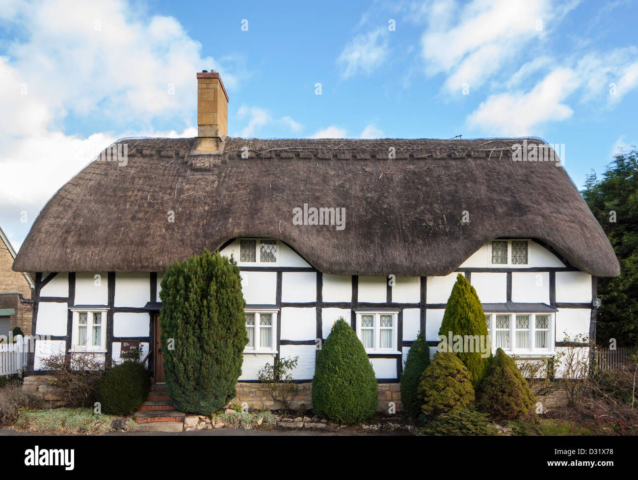Half timbered thatched cottage in the village of Bredon, Worcestershire ...