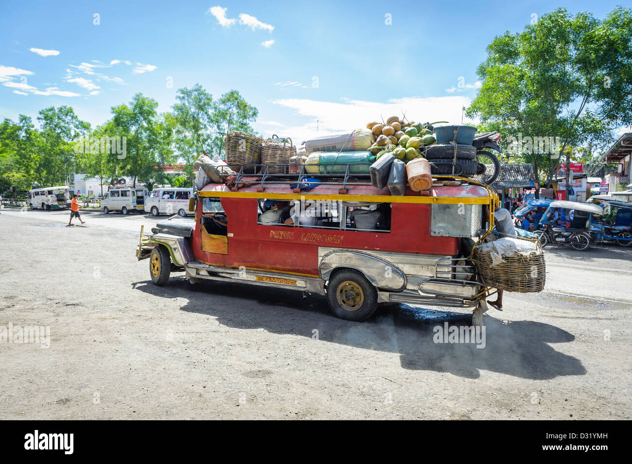 Overloaded jeepney starting the journey at Puerto Princesa bus station ...