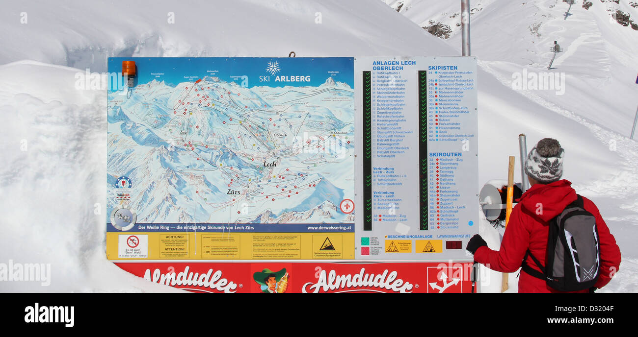 A skier checking the map for the Ski Arlberg Region in Lech, Austria ...