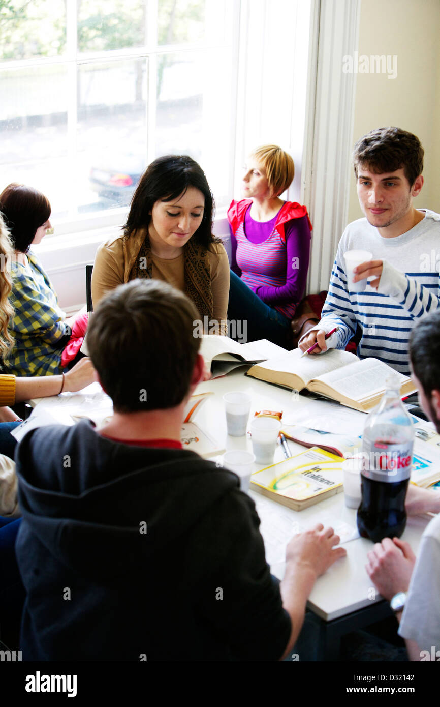 Students learning and studying in a classroom environment together ...