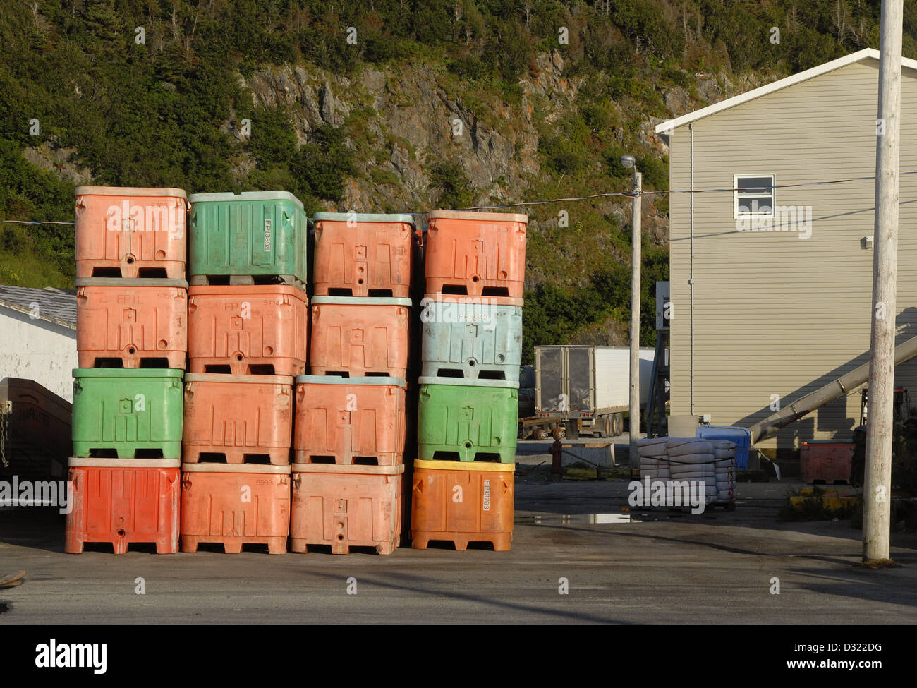 Fish crates stacked at a harbour on the Northern Peninsula ...