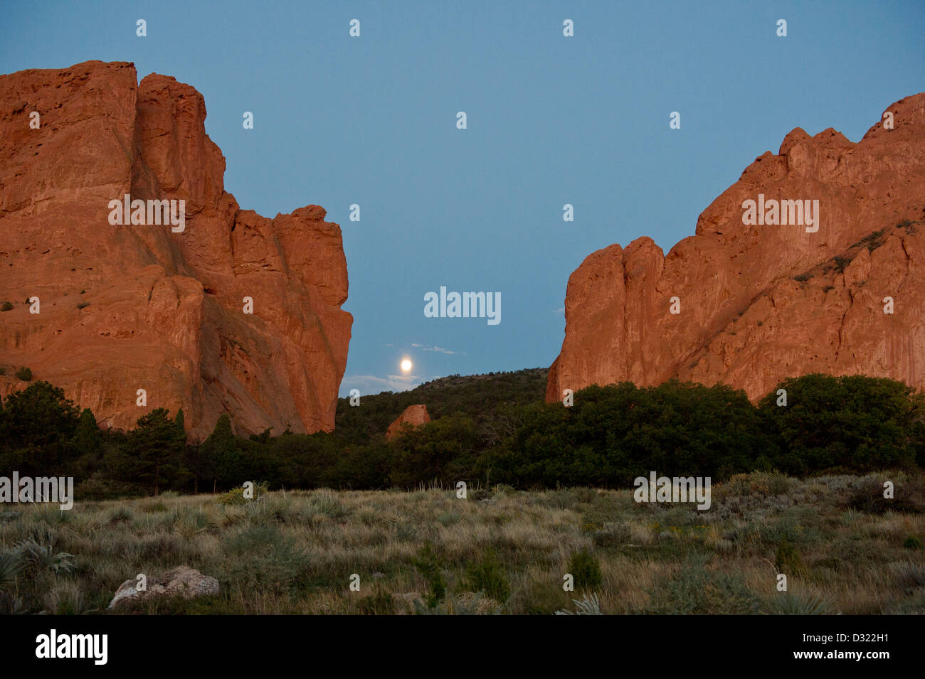 Red cliffs rising in rural landscape Stock Photo - Alamy
