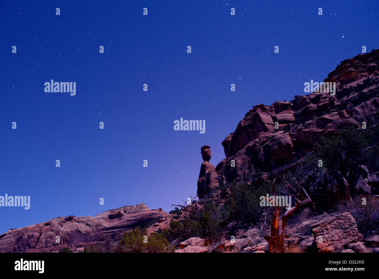 Rock formations in desert at night Stock Photo - Alamy