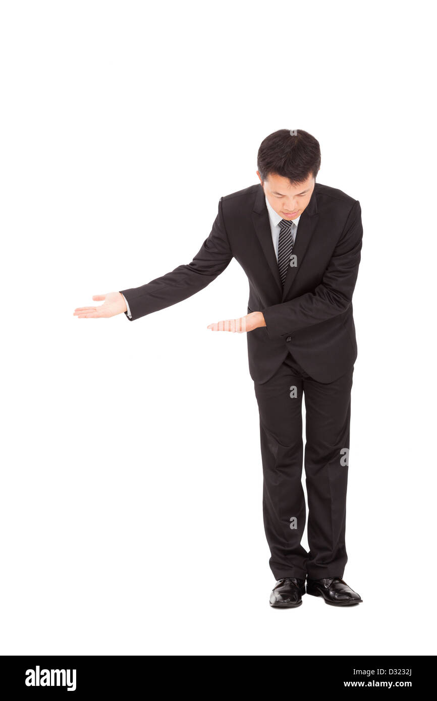 full length of asian businessman with bow and welcome gesture Stock ...