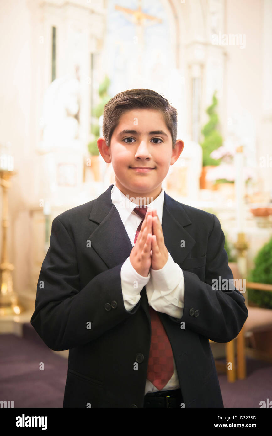 Hispanic child boy praying in hi-res stock photography and images - Alamy