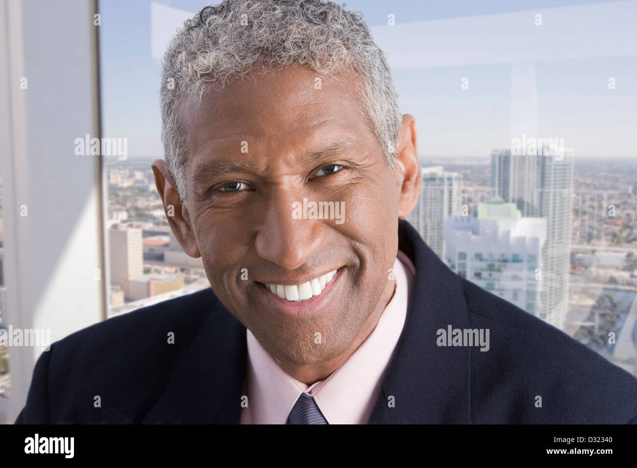 Smiling mixed race businessman Stock Photo - Alamy