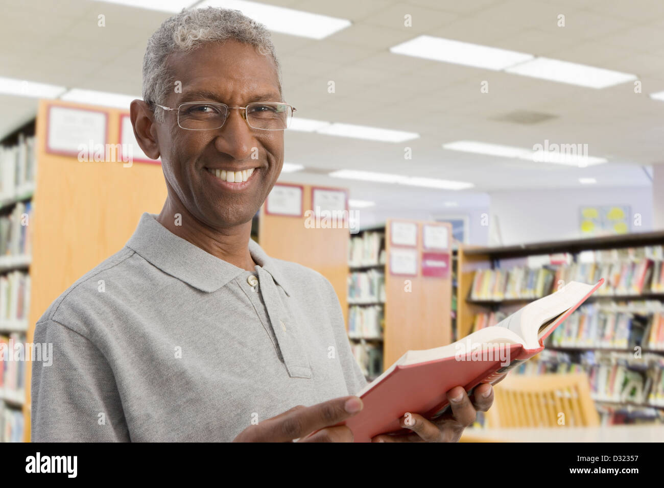 African american man reading in library hi-res stock photography and ...