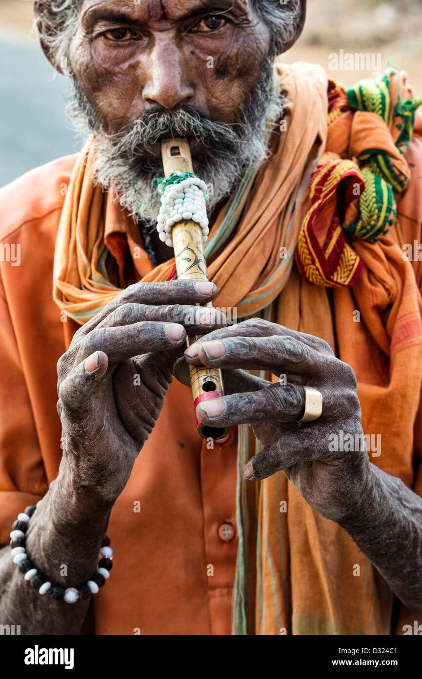 Indian man playing the flute hi-res stock photography and images - Alamy