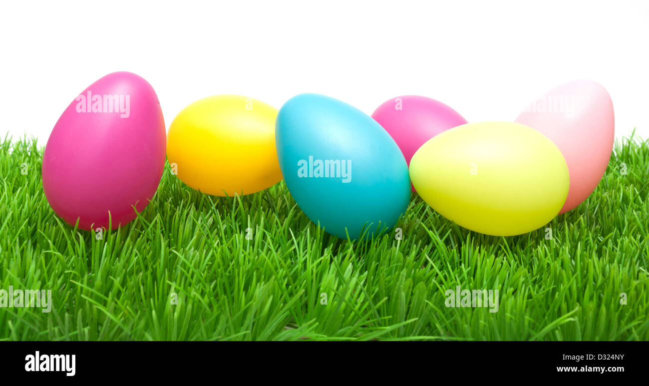 Color Easter Eggs in Grass On White Background Stock Photo - Alamy