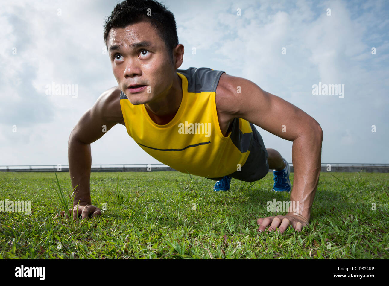 Chinese man performing a push up in the city park Stock Photo - Alamy