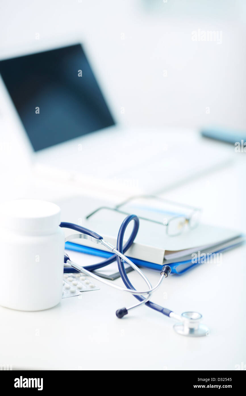 Vertical image of medical stuff being arranged on desk Stock Photo - Alamy