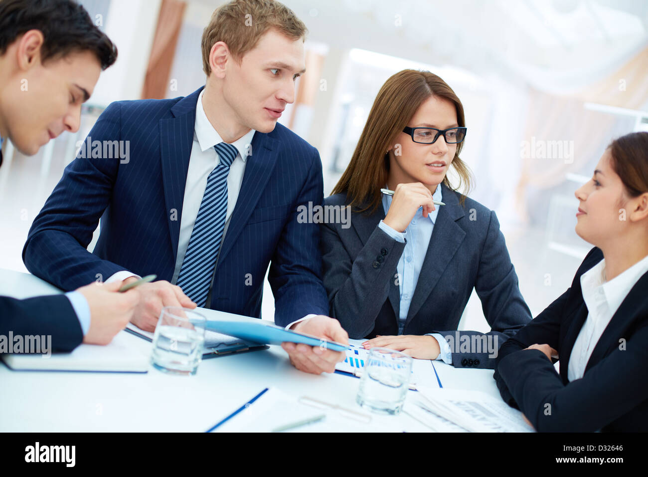 Group of confident business partners planning work at meeting Stock ...
