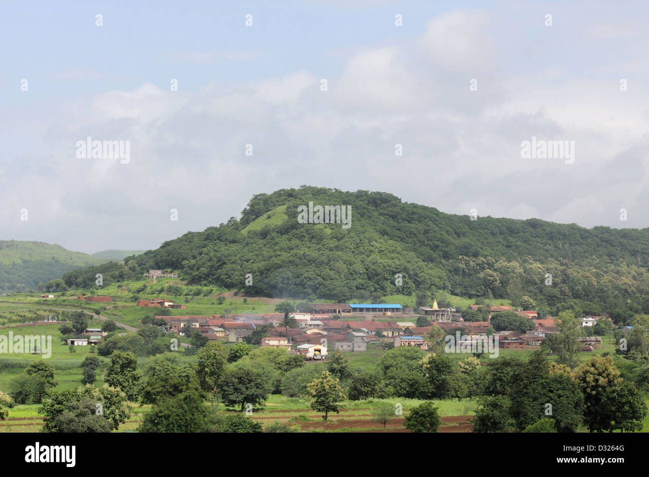 Village landscape with mountains and houses Stock Photo - Alamy