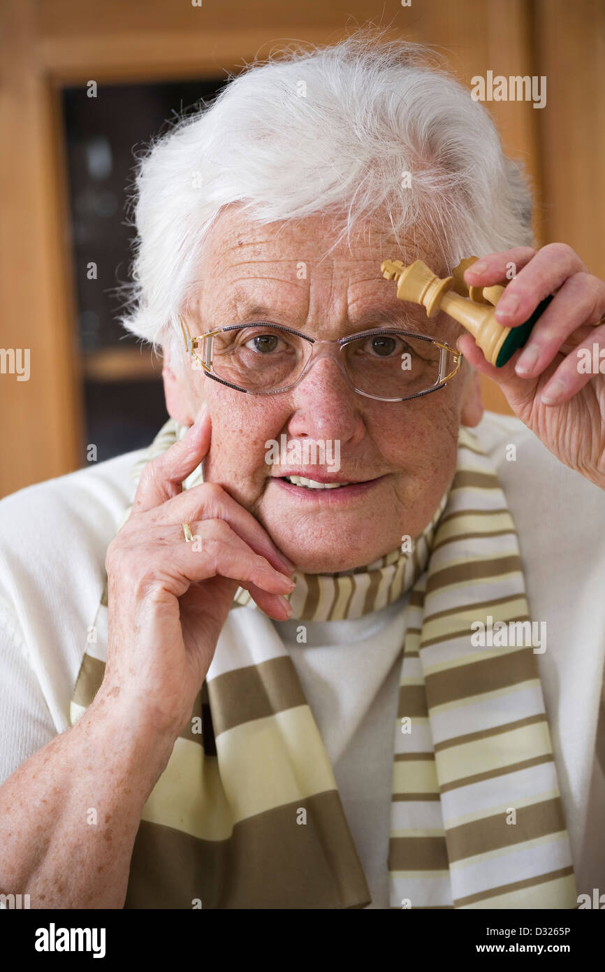 Old lady playing chess hi-res stock photography and images - Alamy