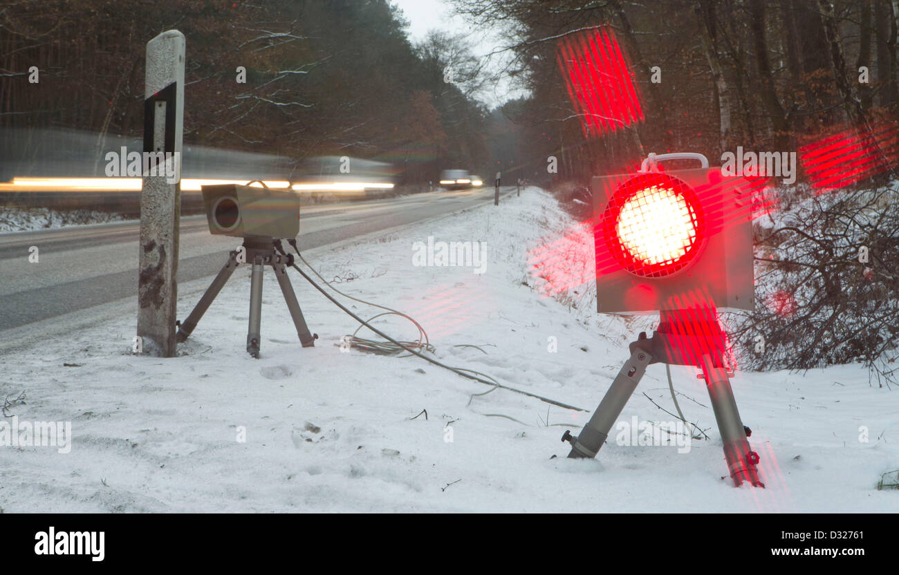 The illustration shows a speed control camera in operation along a ...