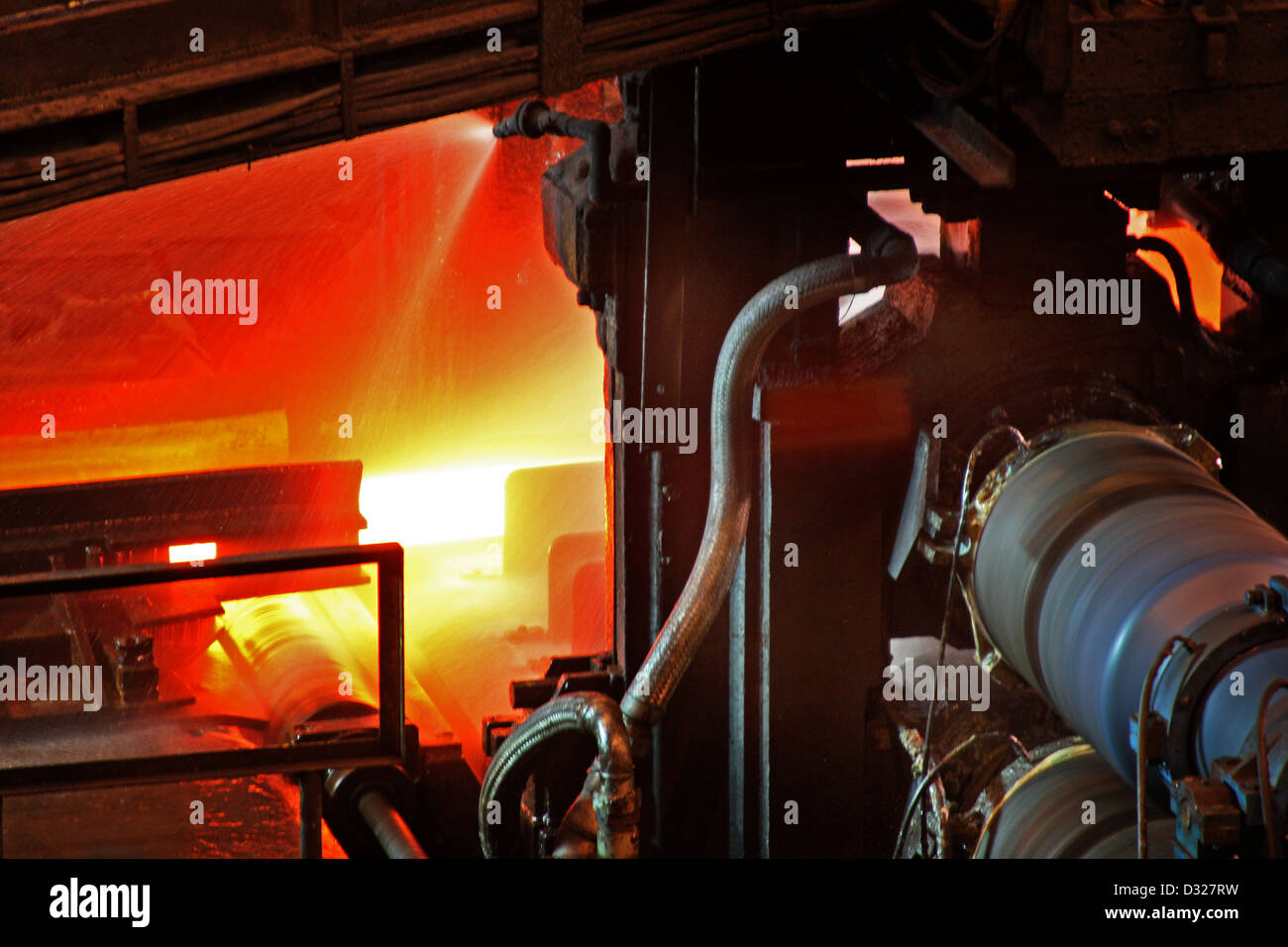 Rolling hot steel bar Stock Photo - Alamy