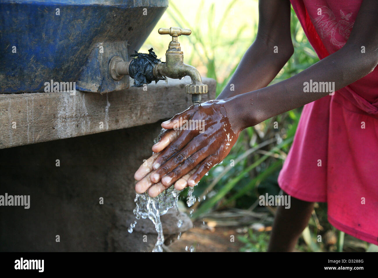 Swaziland woman water hi-res stock photography and images - Alamy