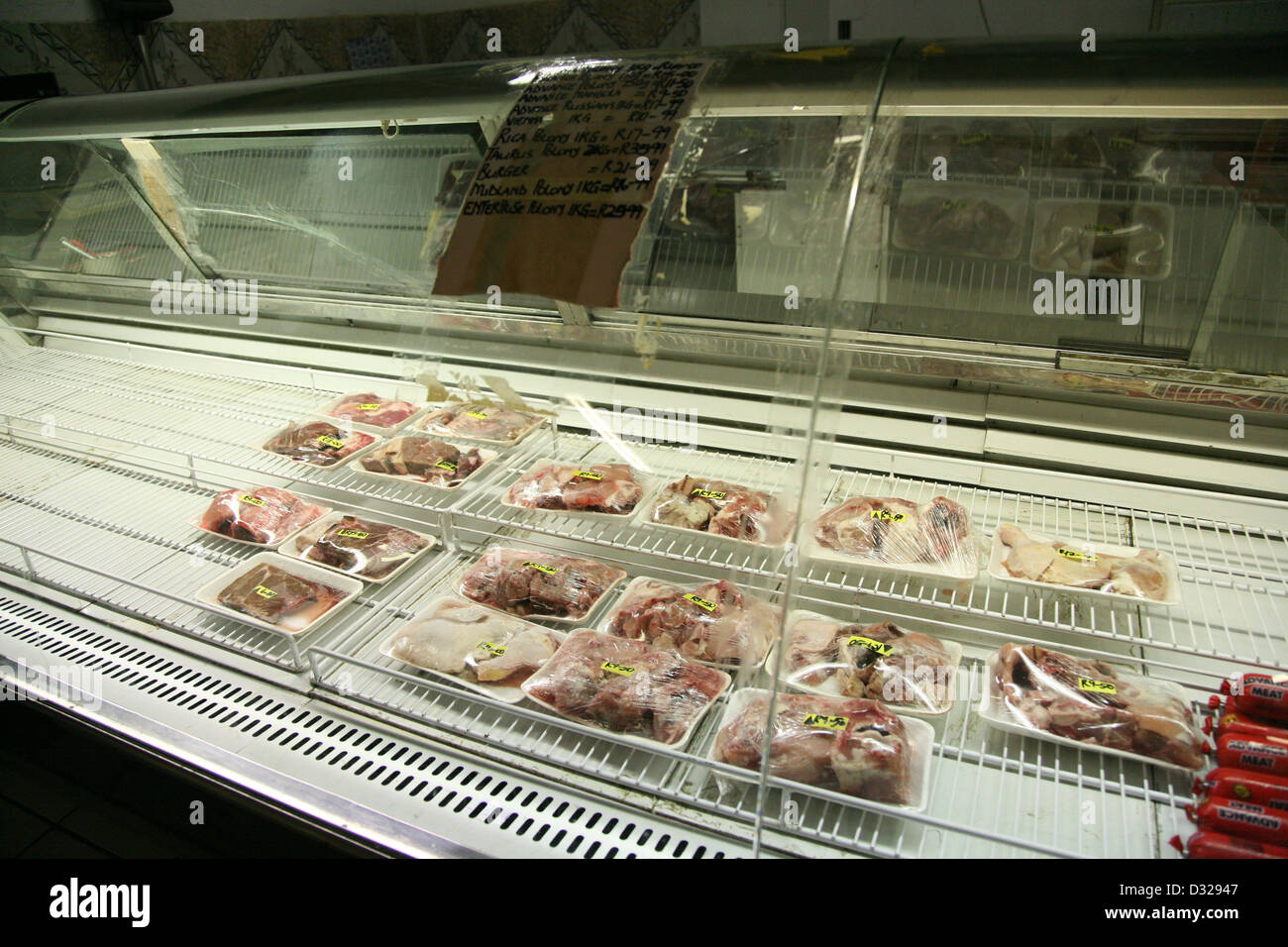 The meat counter hosting red meat, chicken, and polony sausages Stock ...