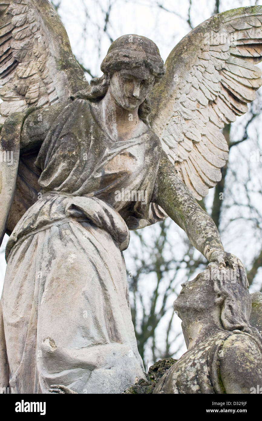 statue in a cemetery at fall Stock Photo - Alamy