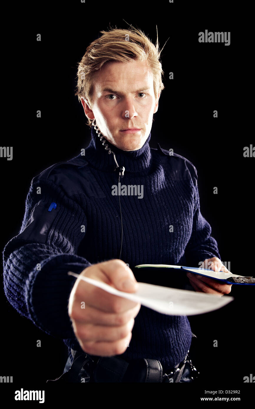 Serious Police Officer Handing You a Fine Isolated On Black Stock Photo ...