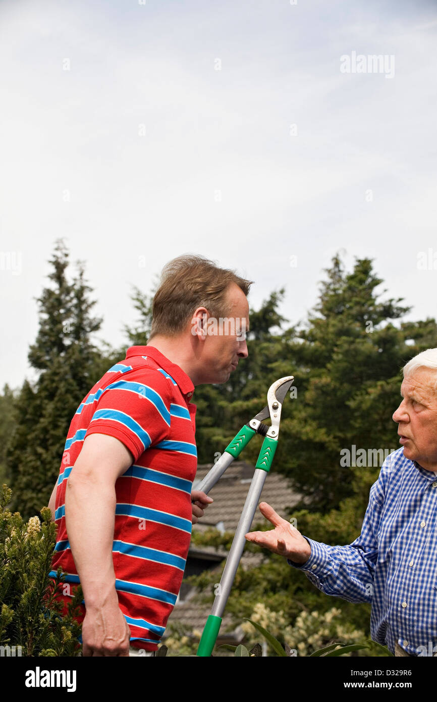 Neighbors argue fence hi-res stock photography and images - Alamy