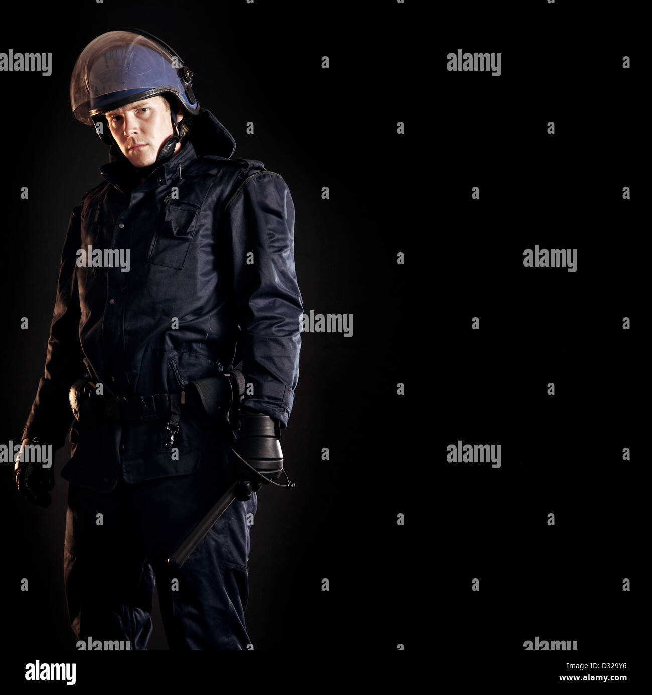 Law enforcer in protective uniform ready for crowd control isolated on ...