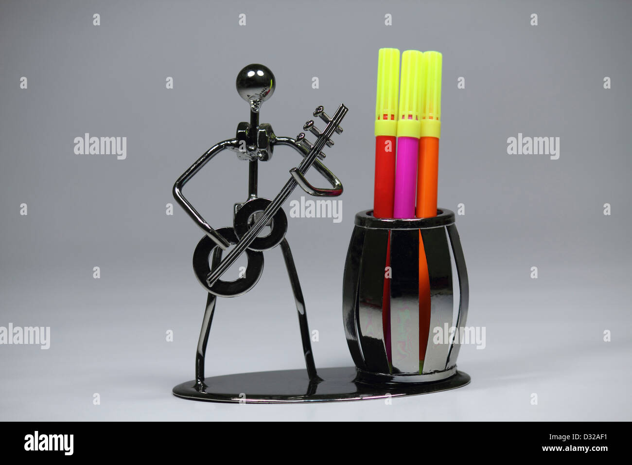 Colour Sketch Pen In The Metal Musical Paperweight Stock Photo - Alamy