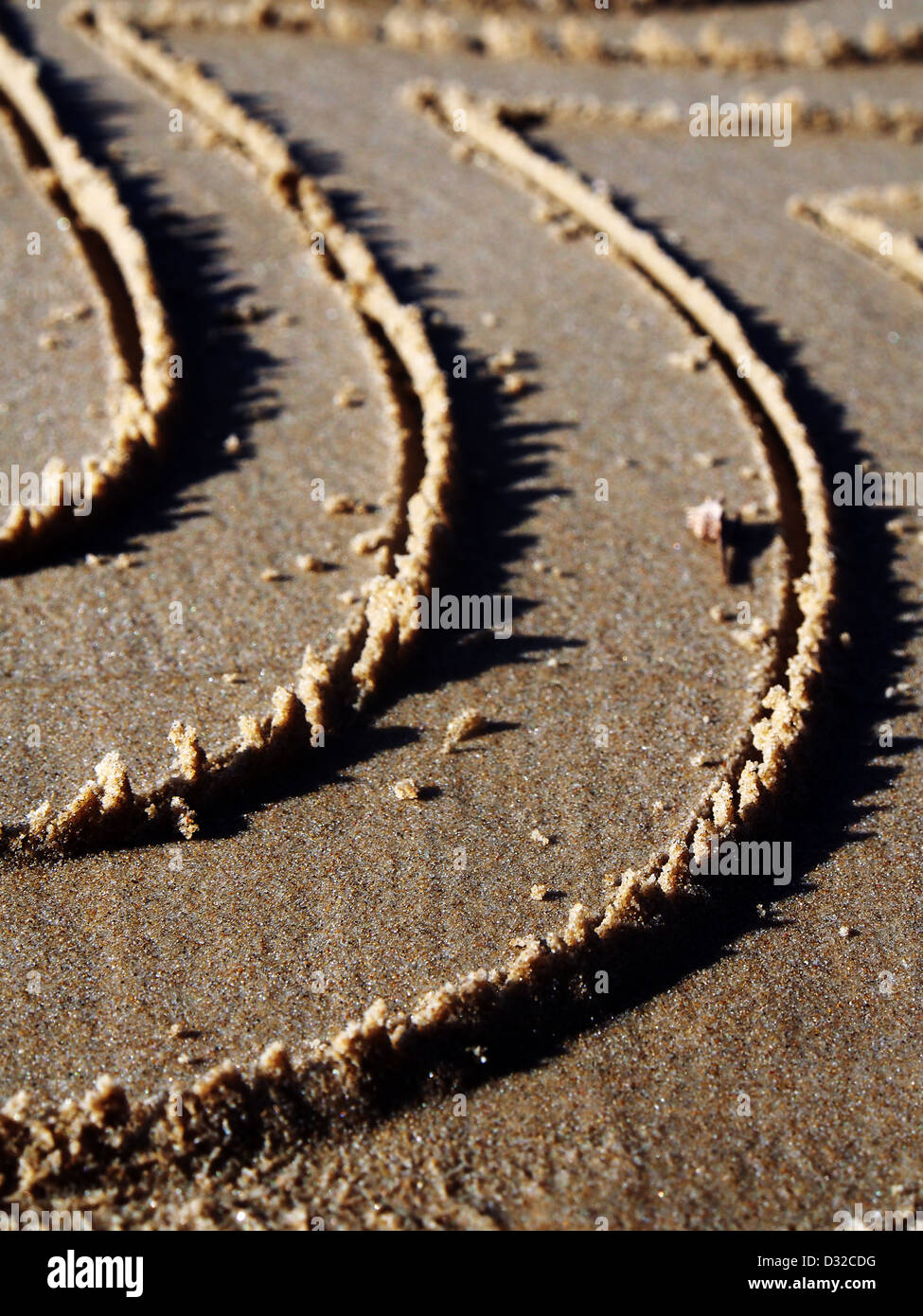 Shapes and groove Markings drawn in the sand at the beach Stock Photo ...