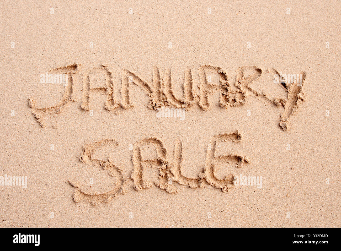 january sale written in the sand on a beach Stock Photo - Alamy