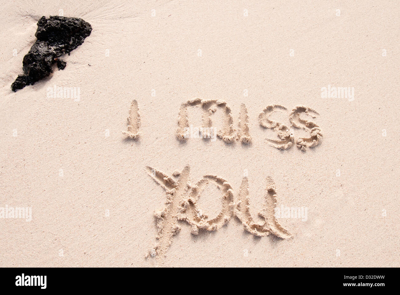 I miss you written in the sand on a beach Stock Photo - Alamy