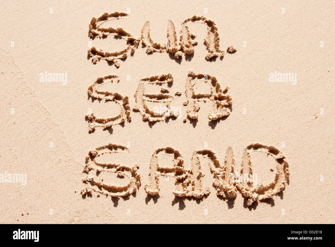 sun, sea, sand written in the sand on a beach Stock Photo - Alamy