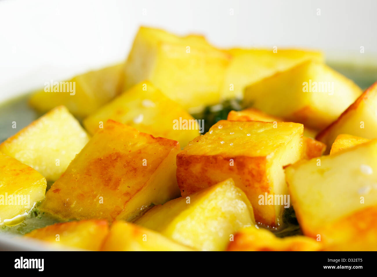 Fried paneer with sesame seeds and spinach Stock Photo - Alamy
