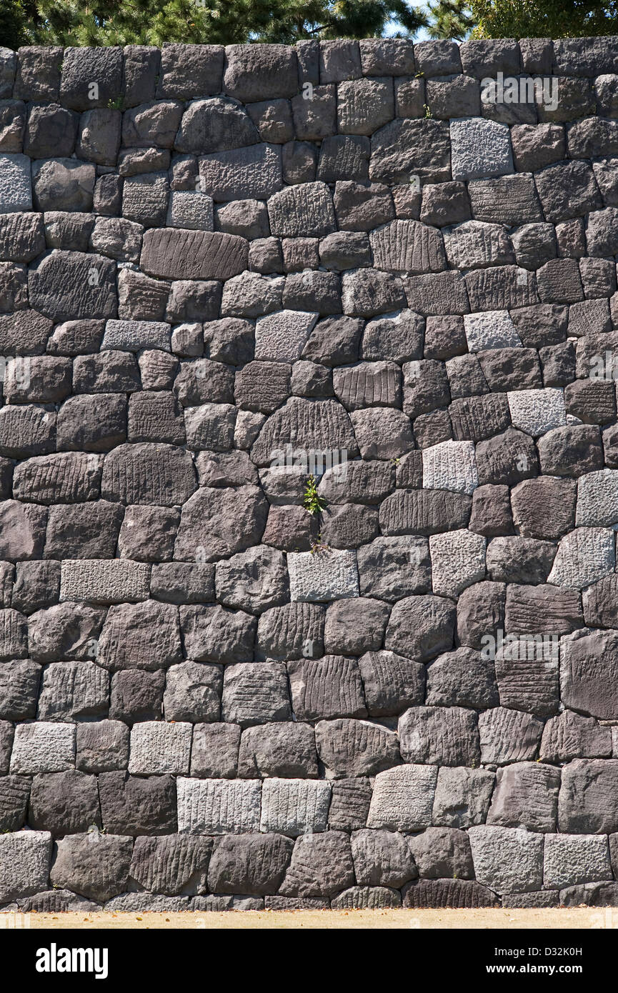 In the Japanese Imperial Palace in Tokyo, Japan, massive stone walls ...