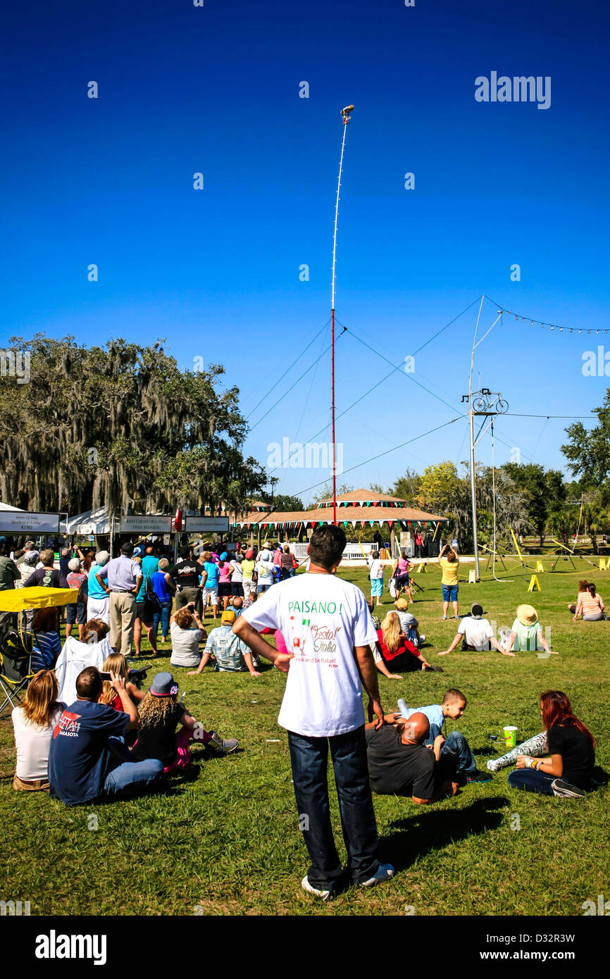 Carla Wallenda on top of a 100ft pole performing to the crowd below at ...
