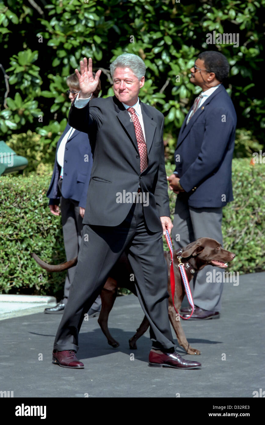 US President Clinton with dog Buddy waves before boarding Marine One ...
