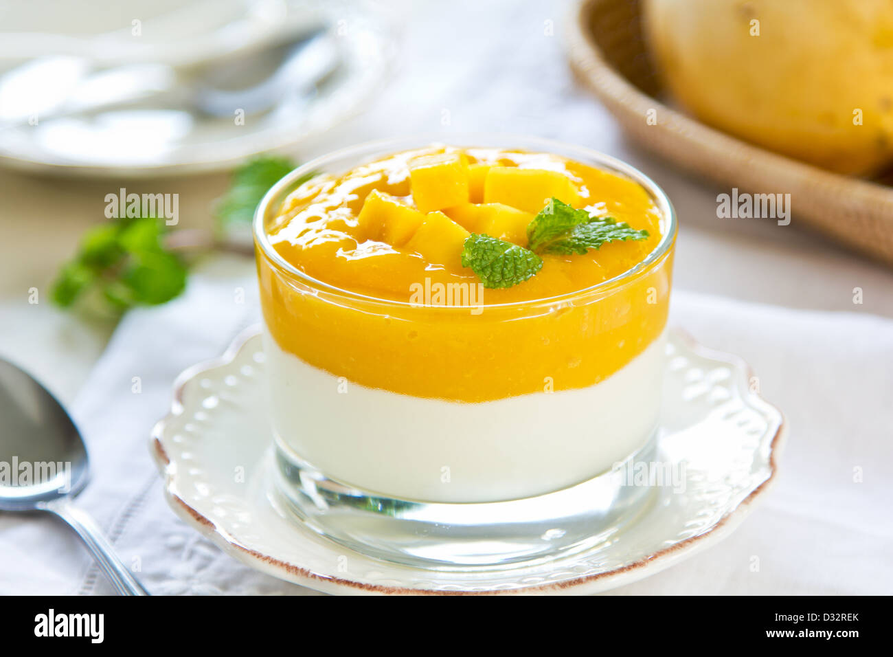 Mango puree and fresh pieces of mango with Greek yogurt Stock Photo - Alamy