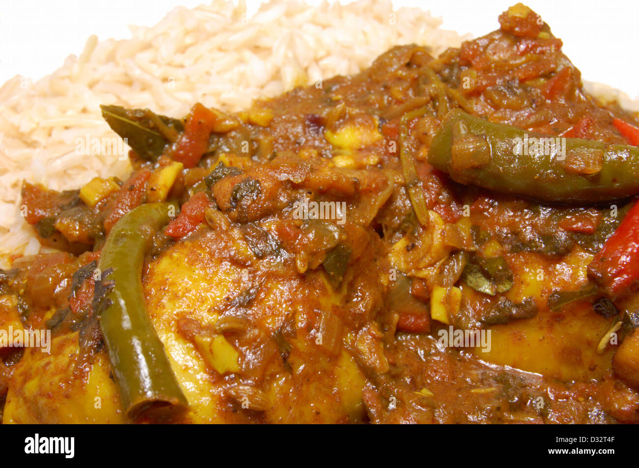 Plate of chicken curry with brown rice Stock Photo - Alamy