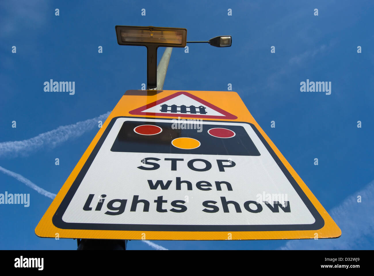 british road sign warning of railway crossing with lights, mortlake ...