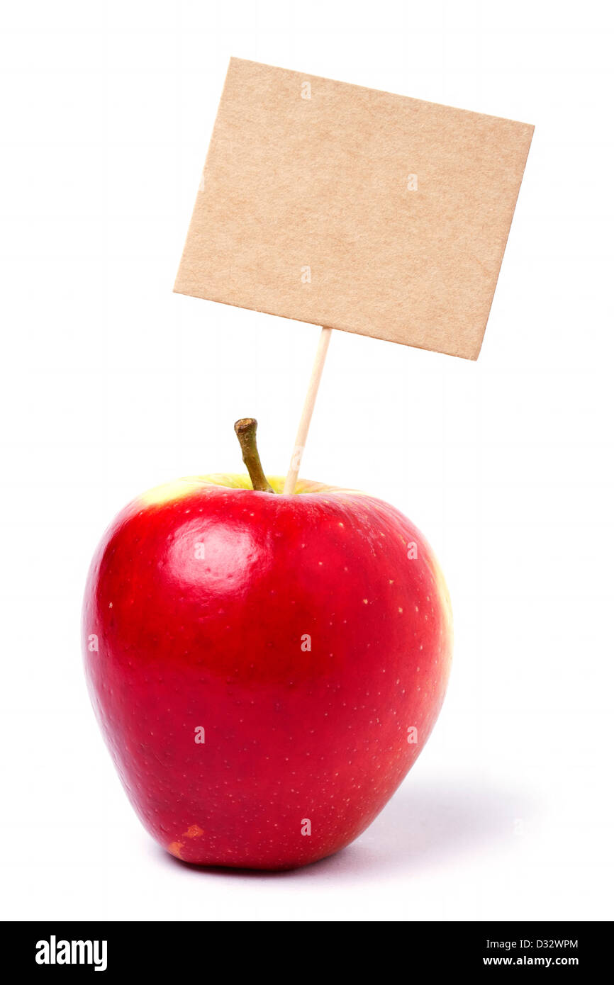 Single ripe apple on white with card on stick Stock Photo - Alamy