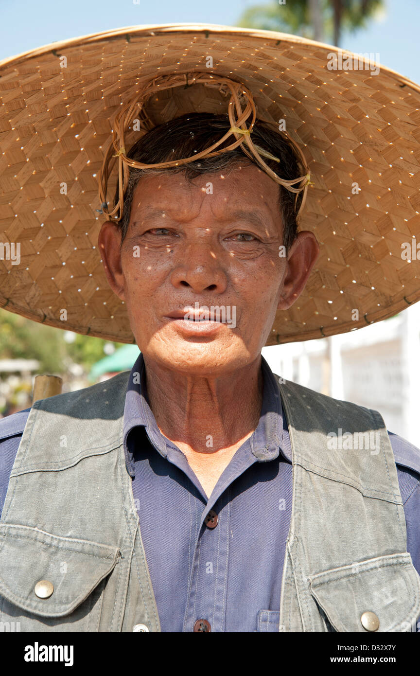 Lao man wearing straw hat in Luang Prabang the old Royal capital of ...