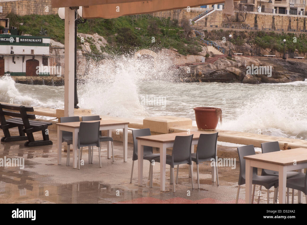 high tide, waves, buildings.turbulent weather,sea, foam,stormy, windy ...