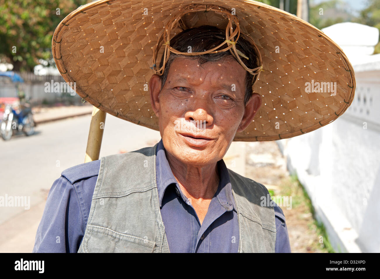 Lao man wearing straw hat in Luang Prabang the old Royal capital of ...