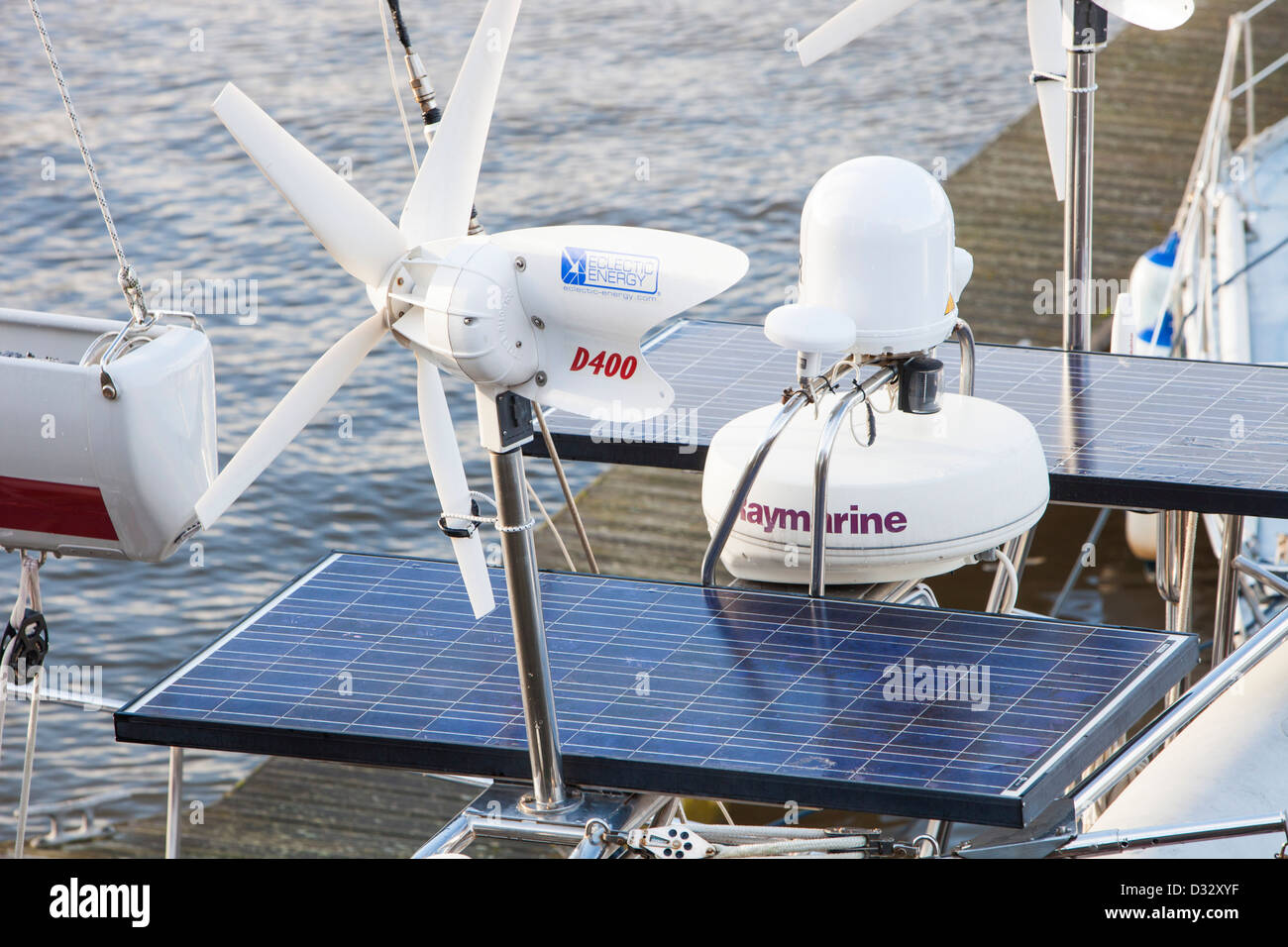 Solar panels and wind turbines to provide power on a yacht Stock Photo ...