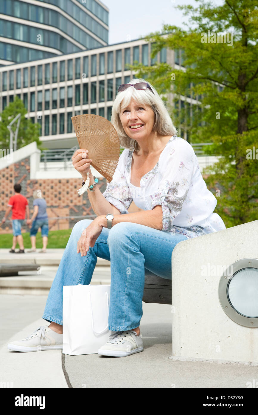 Lady fanning herself hi-res stock photography and images - Alamy