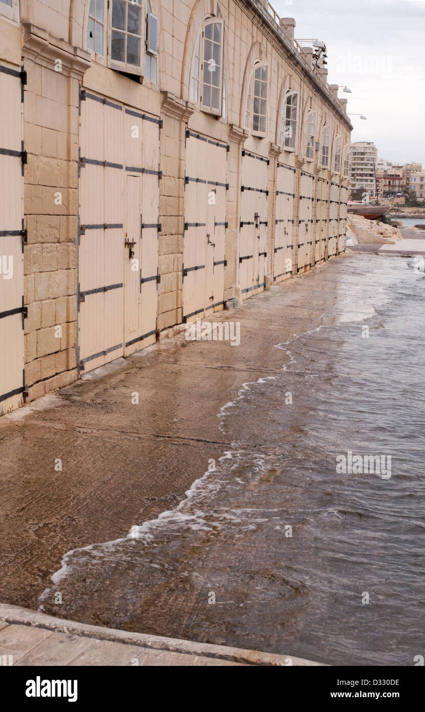 Stone storage buildings, water lapping up against doorways,high tide ...