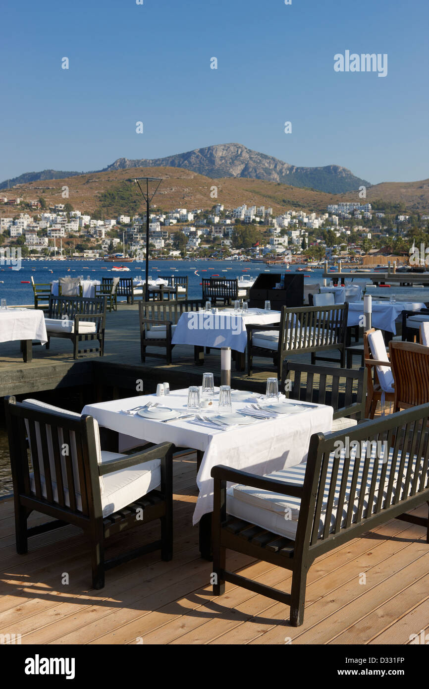 Open-air restaurant’s seating with a scenic view. Golturkbuku, Bodrum ...