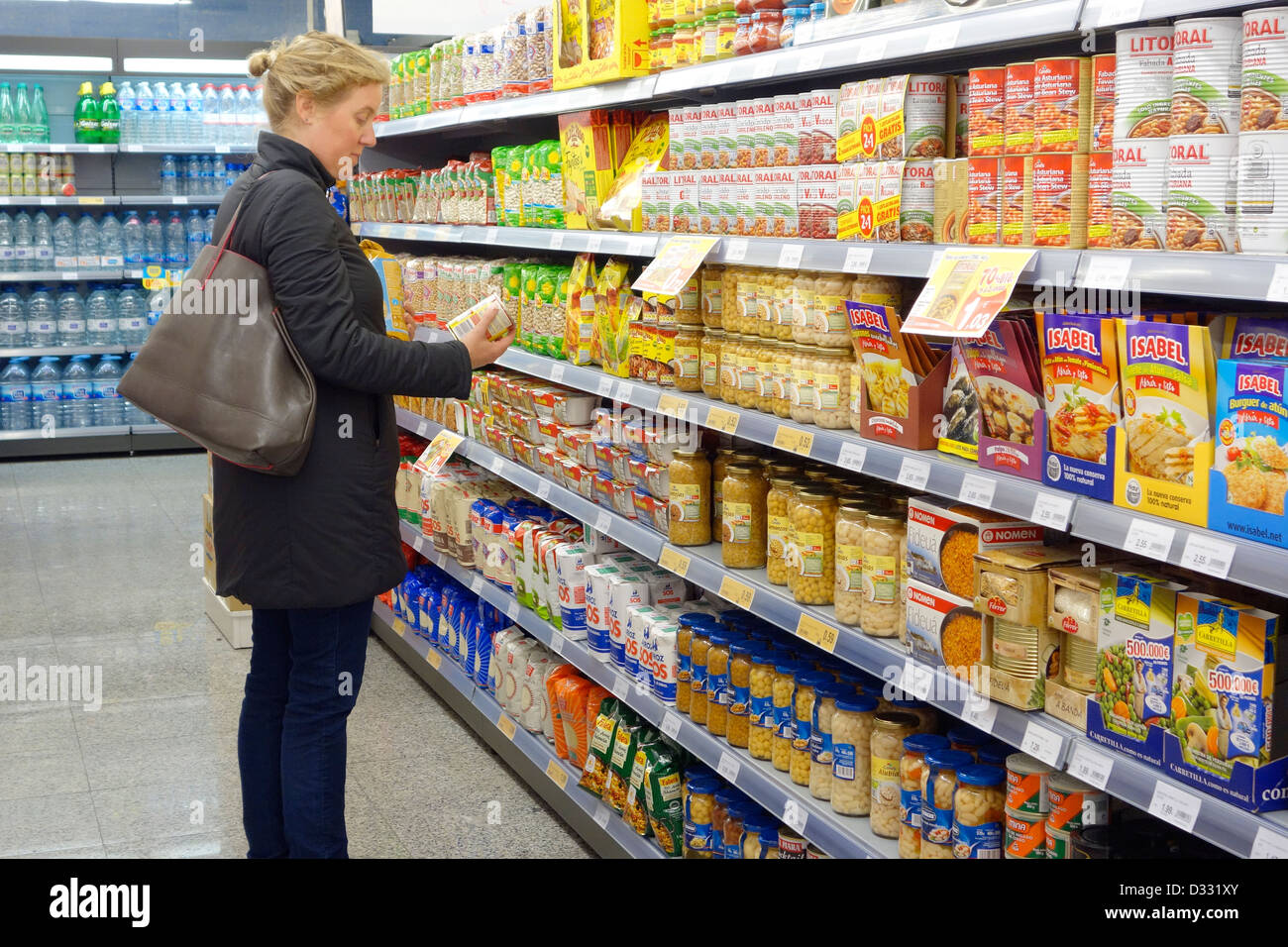 woman shopping grocery label reading products Stock Photo - Alamy