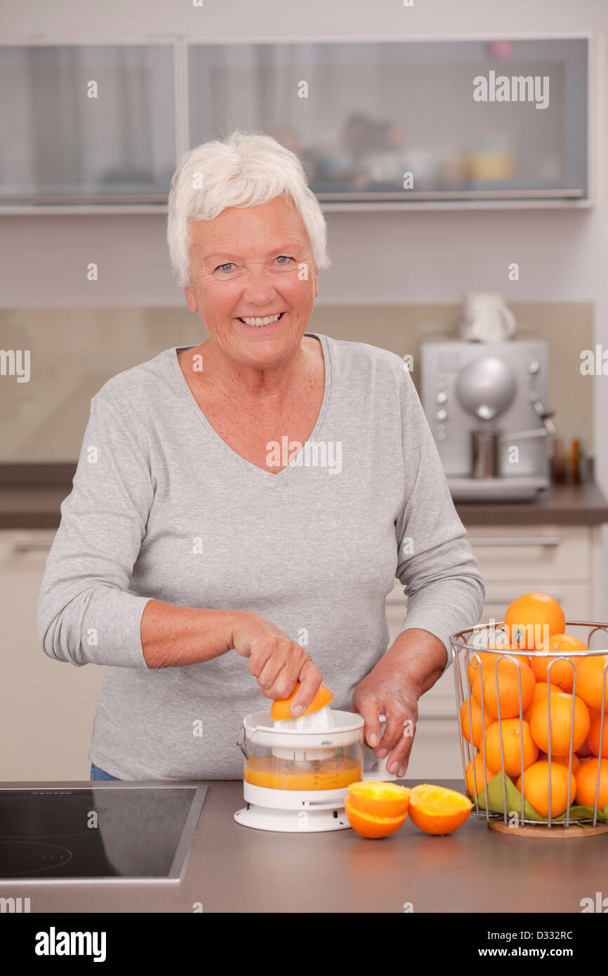 Elderly woman drinking fruit juice hi-res stock photography and images ...