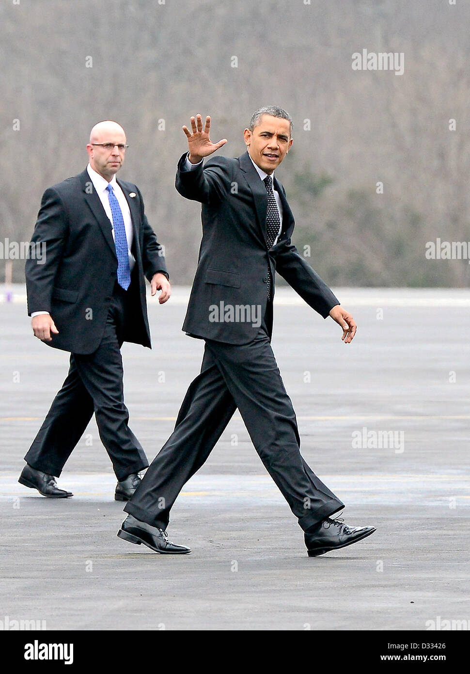 United States President Barack Obama waves to photographers as he ...