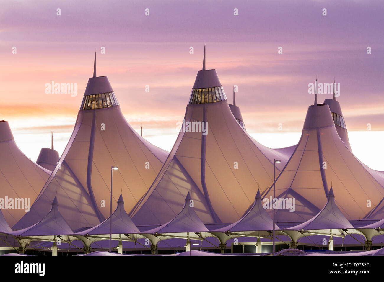 Glowing tents of DIA at sunrise. Denver International Airport well ...